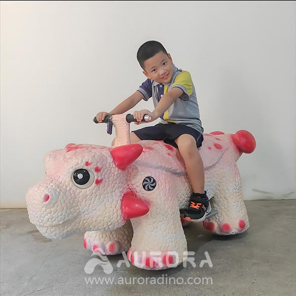 Pink Ankylosaurus Scooter Rides